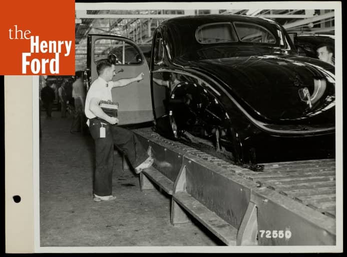 Assembly Line Worker Preparing to Install Radio in Ford Automobile ...