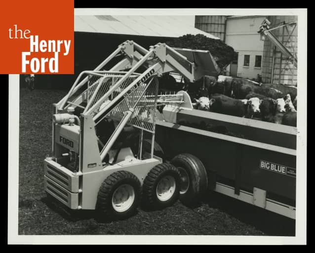 Ford Motor Company Model CL-30 Compact Loader Filling a Manure Spreader ...